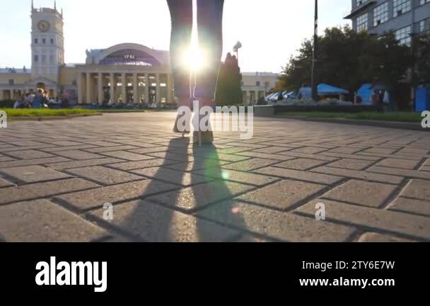 Camera follow to female legs in high heels shoes walking in urban ...