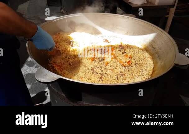 National Uzbek Dish Pilaf, Pilaw, Plov, Rice with Meat. Uzbek Pilaf in ...
