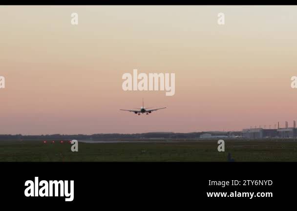 Commercial airplane landing during sunset Stock Videos & Footage - HD ...