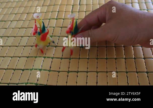 Tohe, the traditional toys in Vietnam made by colored rice powder Stock ...