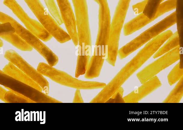 French fries rotating on white background, fast food restaurant, close ...
