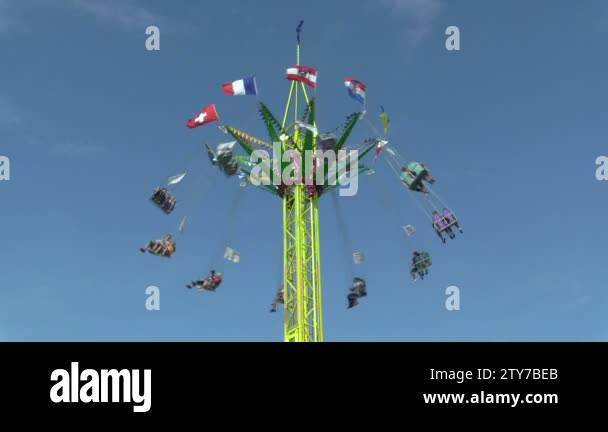 Roundabout chain, fun attraction, fairground with blue sky, carousel ...