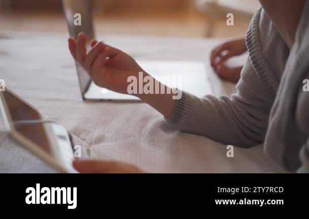 Boys in parents bed at morning with laptop and tablet. Brothers play ...