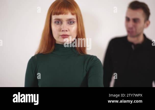 Aggressive angry young man yelling at crying woman with long hair and ...