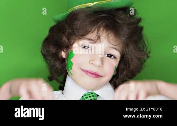 Child Celebrating St. Patrick's Day Showing his Make-up. A small, curvy ...