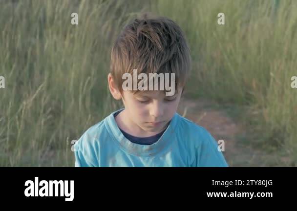 portrait little boy from the slums lowered his head resentfully stood ...