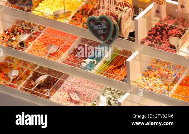 Assorted colorful jelly candies on counter at a food market store ...