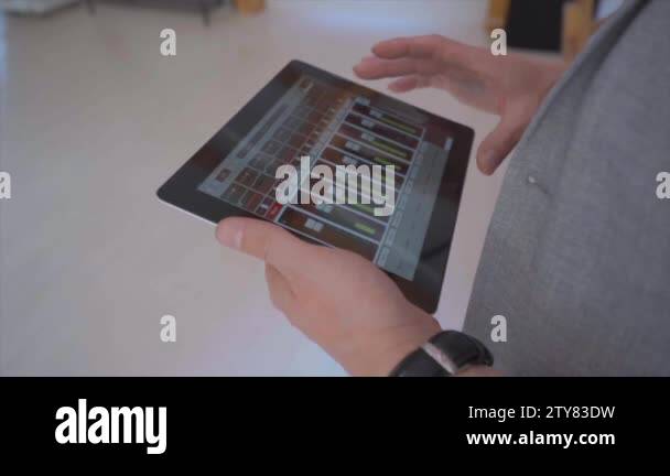 Sound engineer monitors the power level of musical instruments through ...