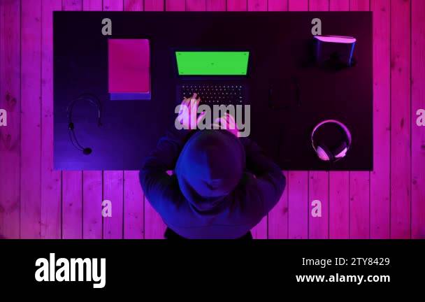 Sad gamer sits at home behind the computer and cries of defeat in the ...