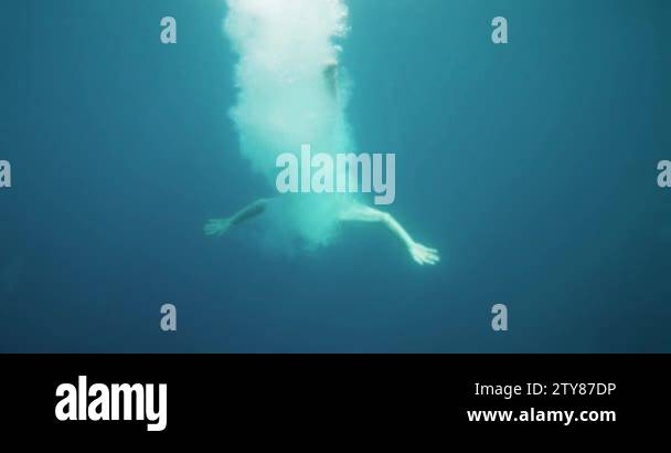 Underwater Footage of Man Jumping into Water and Swimming. Diving in ...