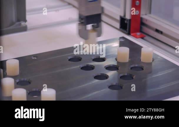 Automated robotic clamp arm moves and places objects at trade show ...