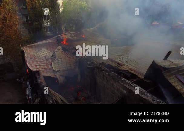 fire industrial building and fog smoke fireman shooting from a height ...