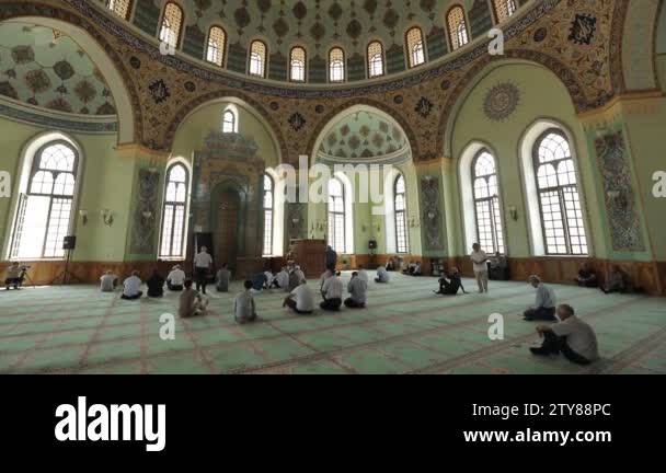 Baku, Azerbaijan - 2019. Muslims pray in a huge beautiful mosque. Men ...