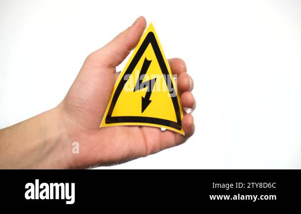 Electrical hazard high voltage sign isolated on white. Male hand ...