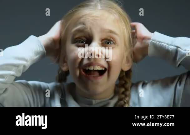 Shocked girl screaming looking at light flashes, disaster ...