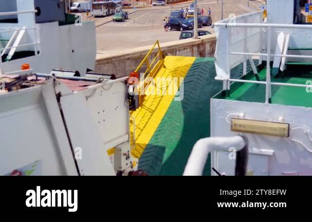 Sea ferry departing from port and lifting up loading ramp. Filmed on ...