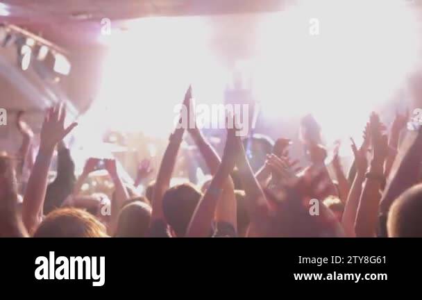 the end of the concert, large group of happy people enjoying rock ...