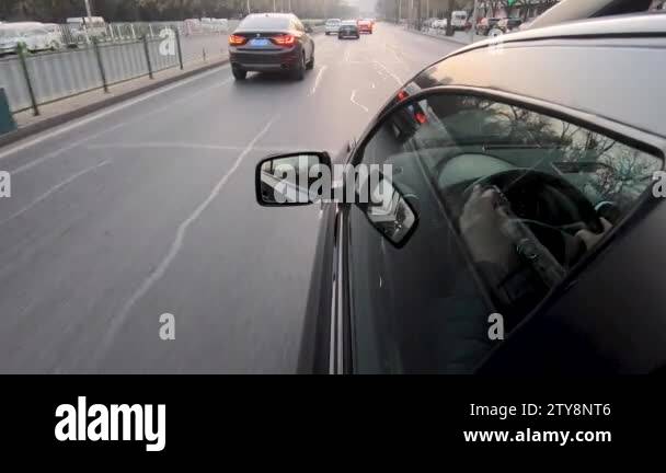 Driving view from side view of the car with reflection on the window ...