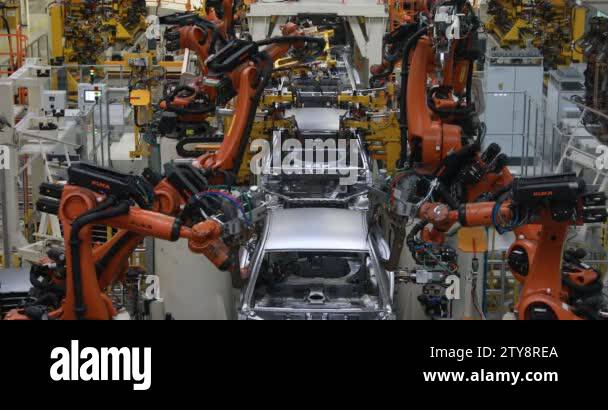 process of welding parts of car in shop for production and Assembly of ...