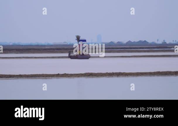 Salt farming, villager are using compact tractors to smooth the soil ...