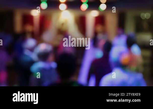 Blurred footage of crazy crowded party with people dancing on the ...
