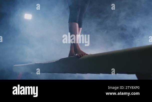 Close-up of the foot of a professional gymnast girl jumping in slow ...