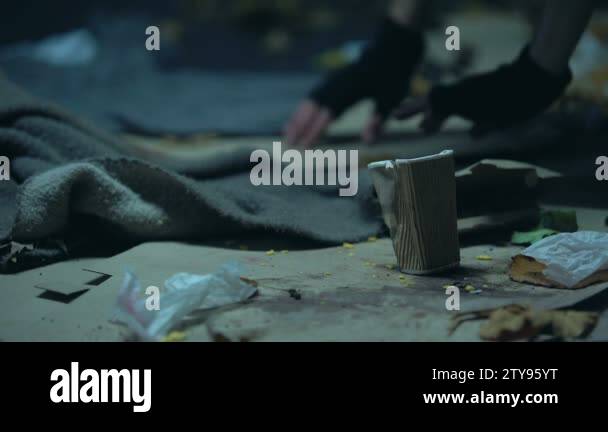 Drunk homeless woman lying down to sleep among garbage, alcohol ...