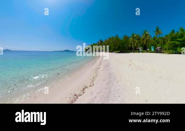 Tropical island with a beach and palm trees. Mahaba Island, Philippines ...