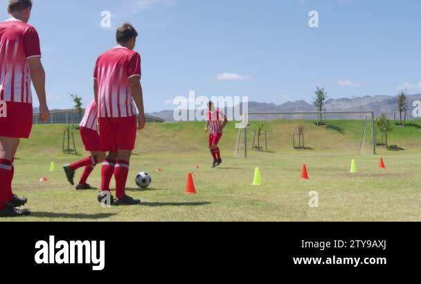 Rear view of a group of Caucasian male football players wearing a team ...