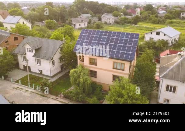 Aerial top view of new modern residential house cottage with blue shiny ...