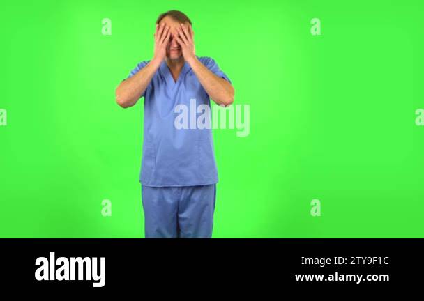 Medical man suffering from headache from fatigue. Green screen Stock ...