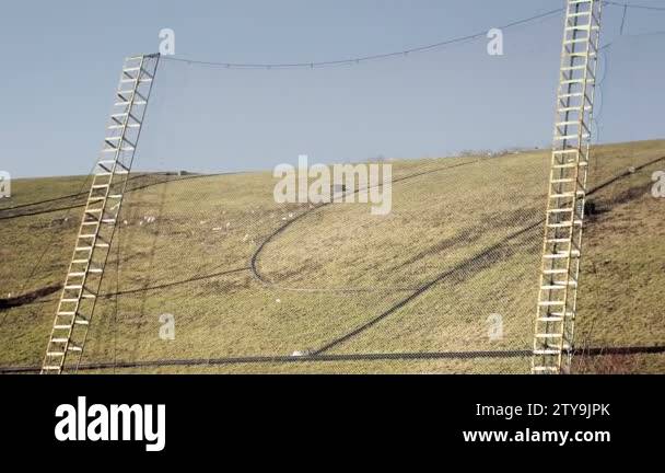 Garbage dump, landfill of municipal waste with protective net on steel ...
