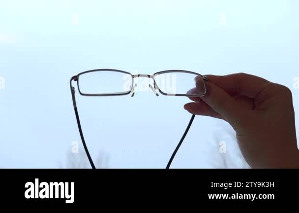 Hand silhouette holding eyeglasses Stock Videos & Footage - HD and 4K ...