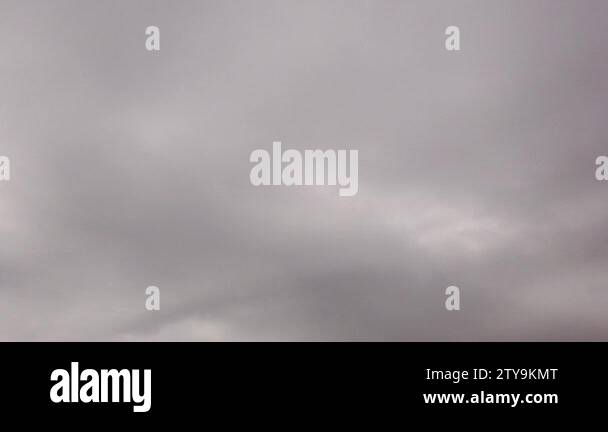 Time lapse background with stormy clouds moving and rolling in the sky ...