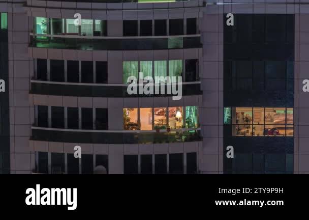 Night view of exterior apartment building timelapse. High rise ...