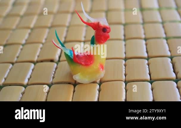 Tohe, the traditional toys in Vietnam made by colored rice powder Stock ...