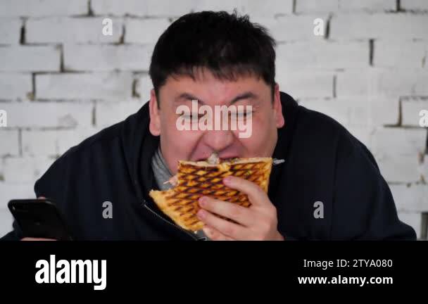 Fat man eating kebab Stock Videos & Footage - HD and 4K Video Clips - Alamy