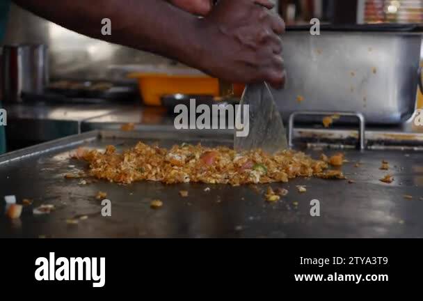 Cooking kothu parotta very popular food in Tamil nadu and Kerala India ...