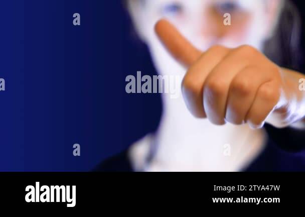 teenage girl turns her thumb in a positive sense to negative sense ...