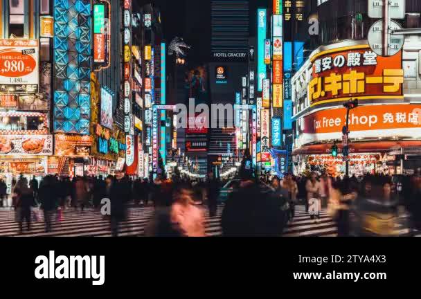 4K UHD time-lapse of crowded people crossing road and car traffic at ...