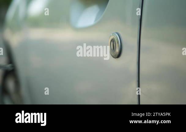 Driver Unlock and Open the Car Door Using a Normal Car Key Stock Video ...