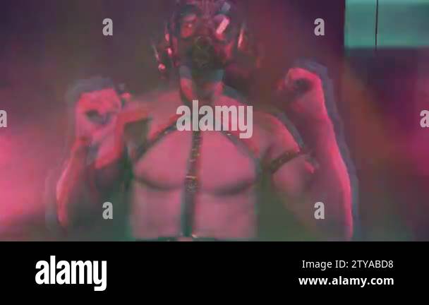 Muscular man dancing in gas mask Stock Video Footage - Alamy