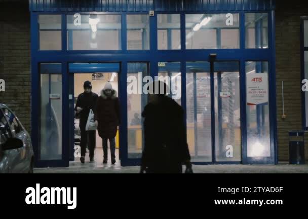 DNIPRO, UKRAINE - JANUARY 12, 2019: People enter and exit through ...