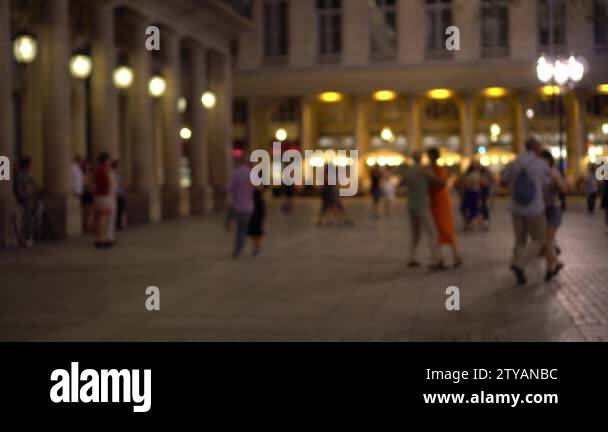 Parisians and tourists dance elegantly in one of the squares of Paris ...