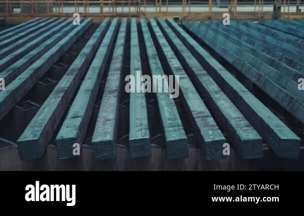 Ready-made steel billets are moving on a manufacturing line at an iron ...