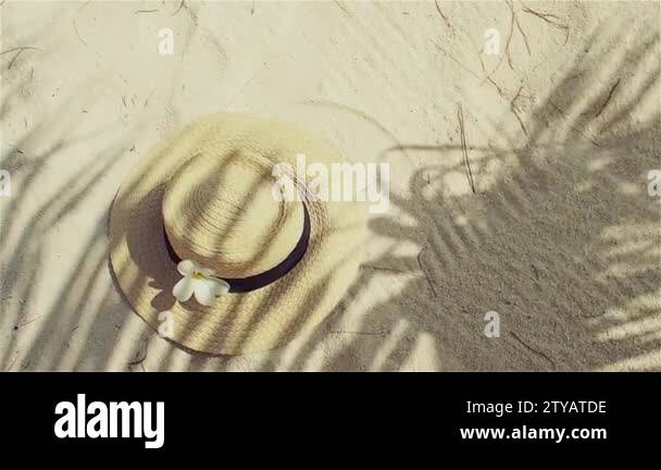 Straw hat on sand Stock Videos & Footage - HD and 4K Video Clips - Alamy