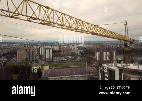 Aerial footage of a tower crane at construction site of new office ...