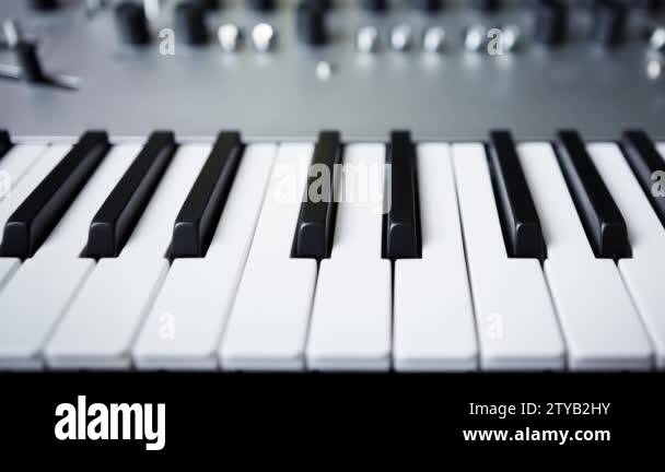 Midi keyboard keys in focus. Digital piano deck for musician. Play ...