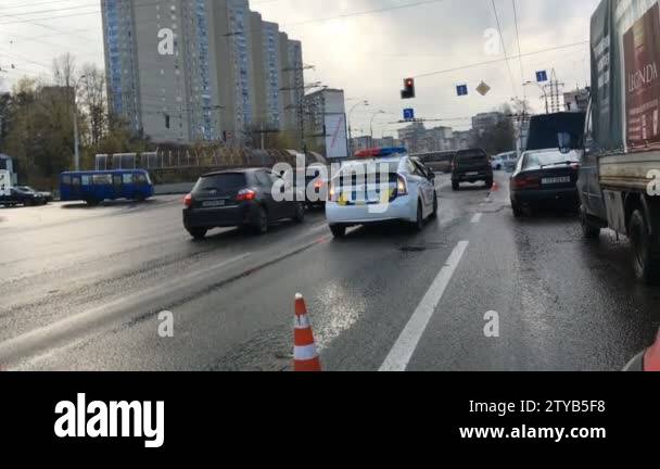 Kiev, Ukraine, December 2019: - Police car standing at crossroads at traffic light, fenced off ...