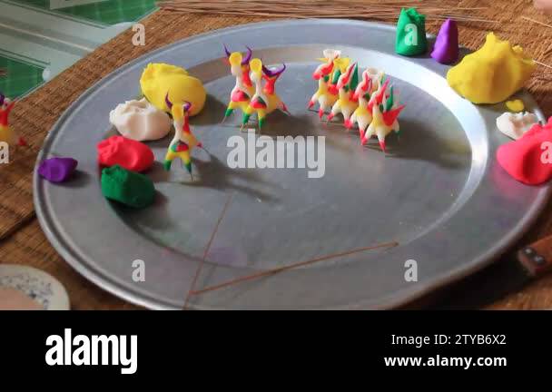 Tohe, the traditional toys in Vietnam made by colored rice powder Stock ...